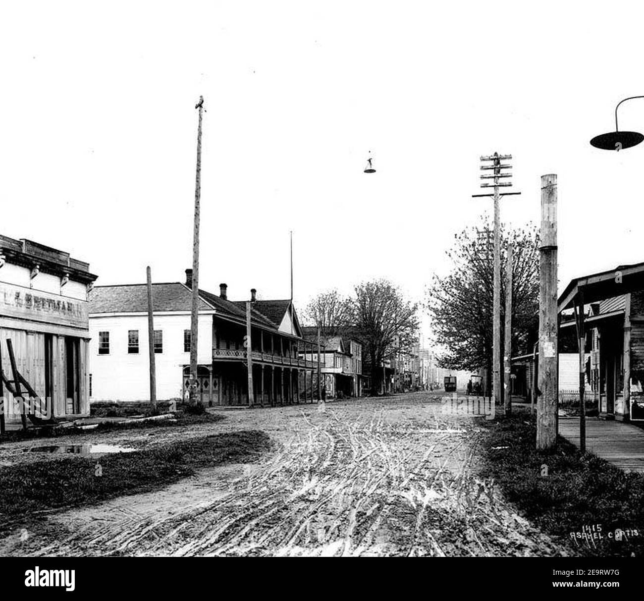 Muddy Main St, Olympia, with streetcar Stock Photo - Alamy