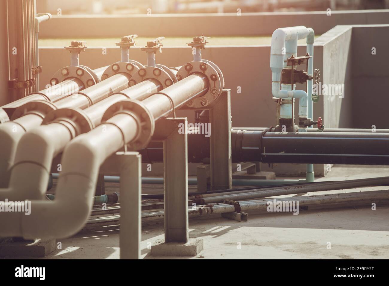 old water pipe system at rooftop of the building vintage color tone ...