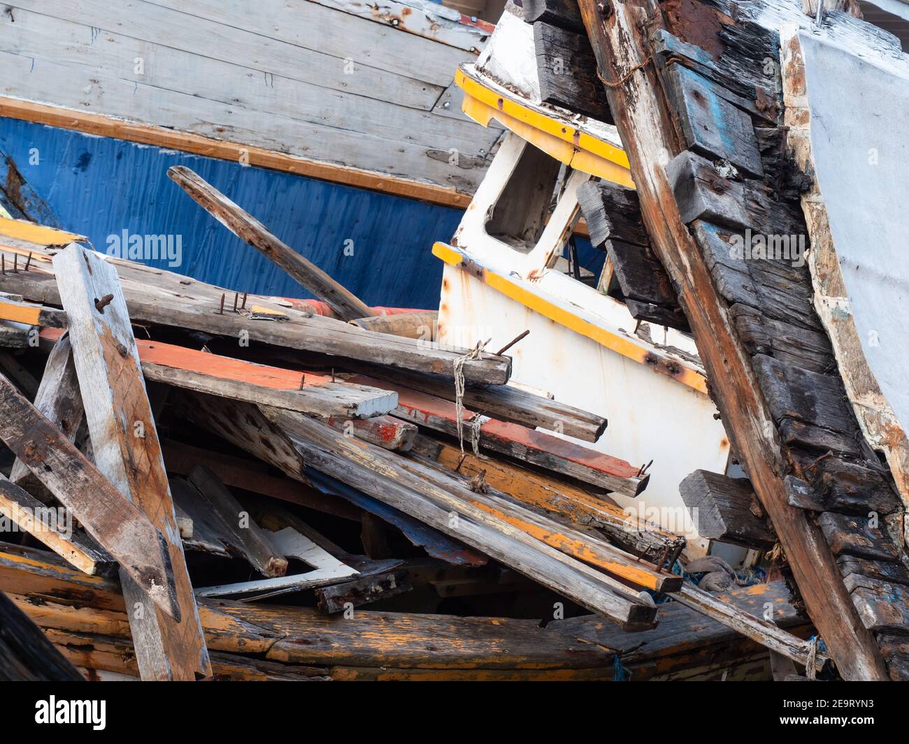 Wrecks of old, wooden fishing boats at a fishing village in the ...