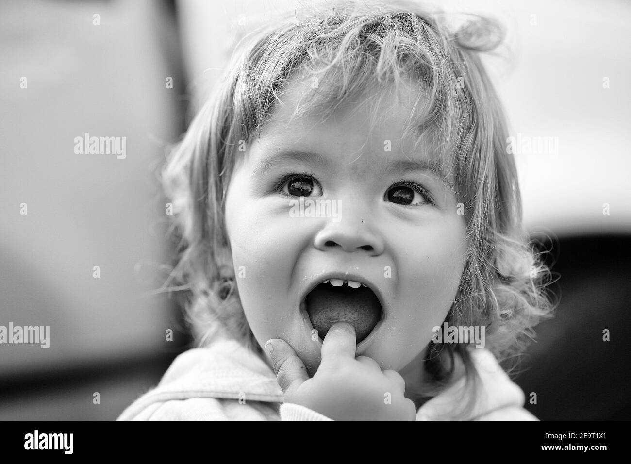 Funny cute kid little child baby boy with finger in mouth Stock Photo ...