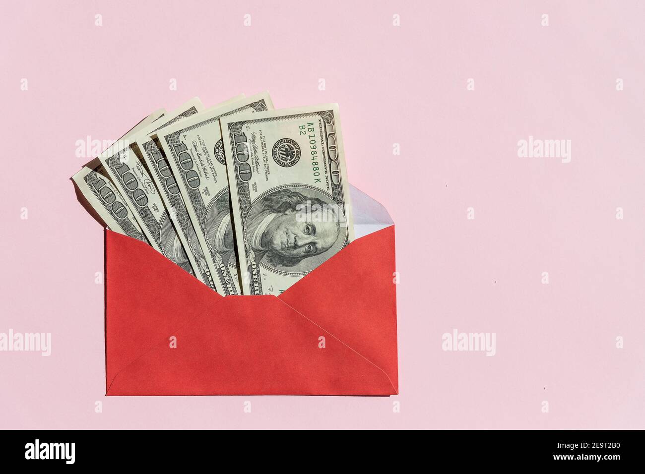 US dollars in an envelope isolated on white background Stock Photo - Alamy