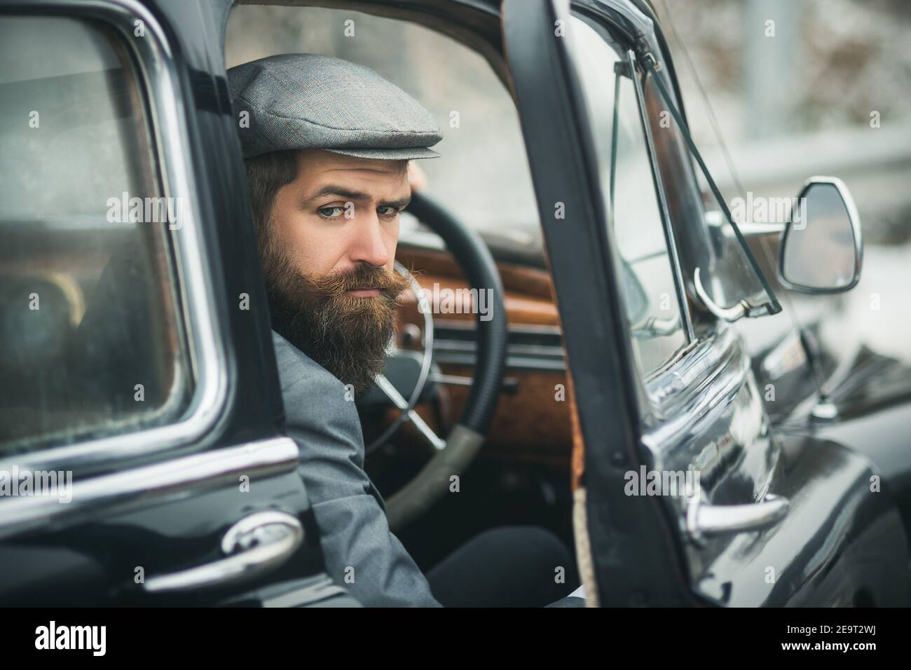 Man driver in retro car. Vintage male model Stock Photo - Alamy