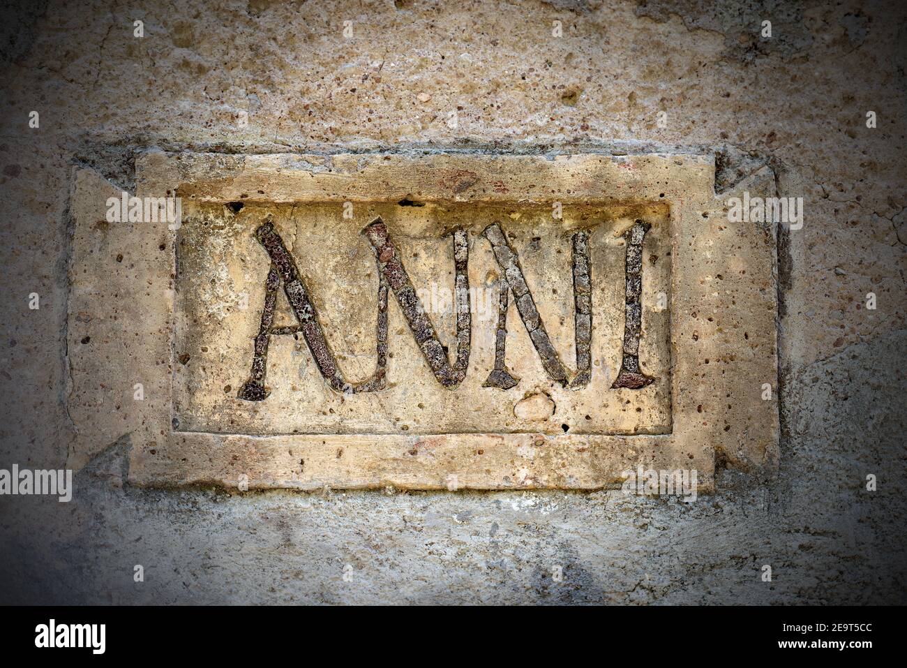 Closeup of an ancient Roman stone plaque with the text in Latin ...