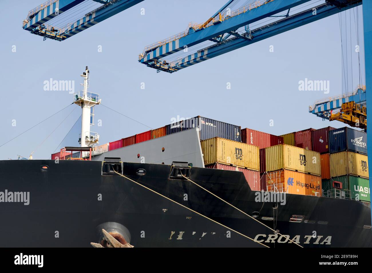 QINGDAO, CHINA - FEBRUARY 6, 2021 - A cargo ship loads and unloads ...