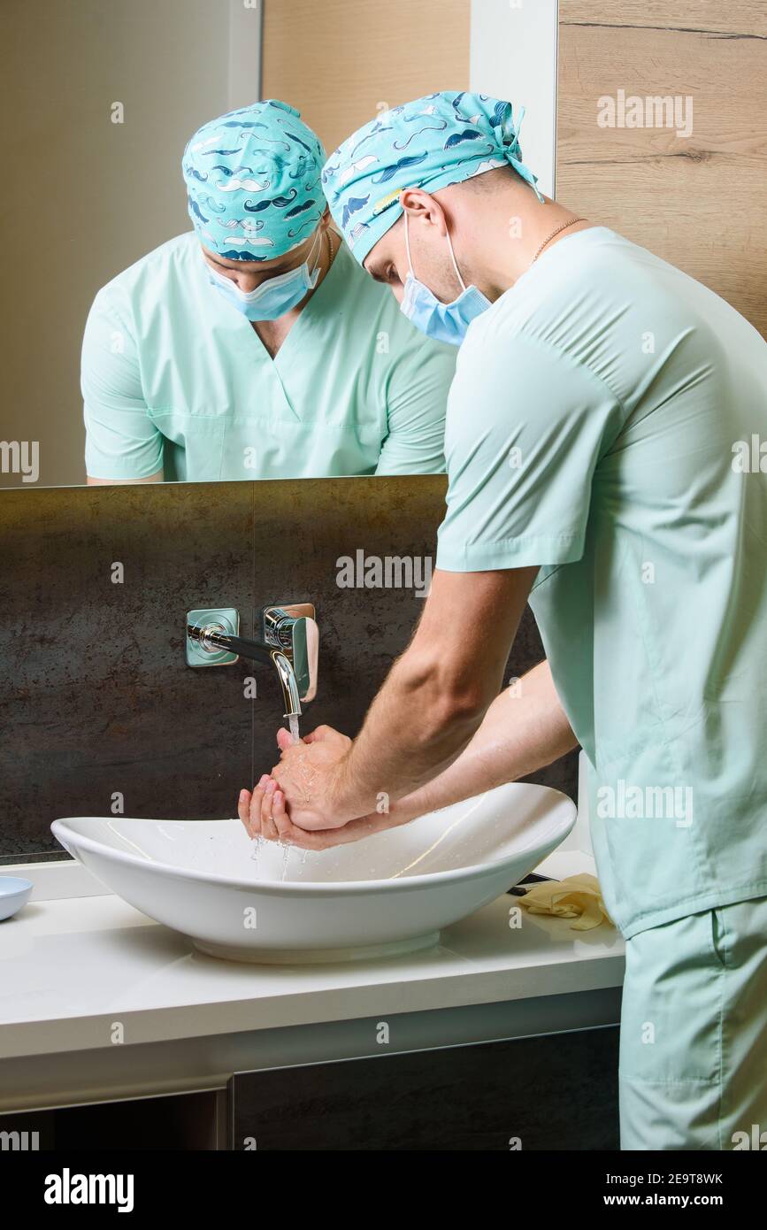 White skin Hygiene. Medical staff is cleaning his hands. Disinfection ...