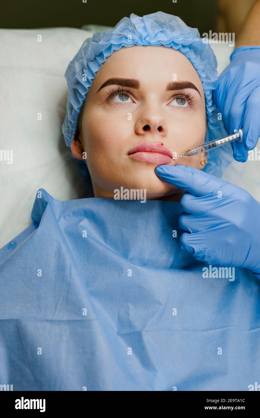 Surgeon does plastic opertation lips augmentation using filler in ...
