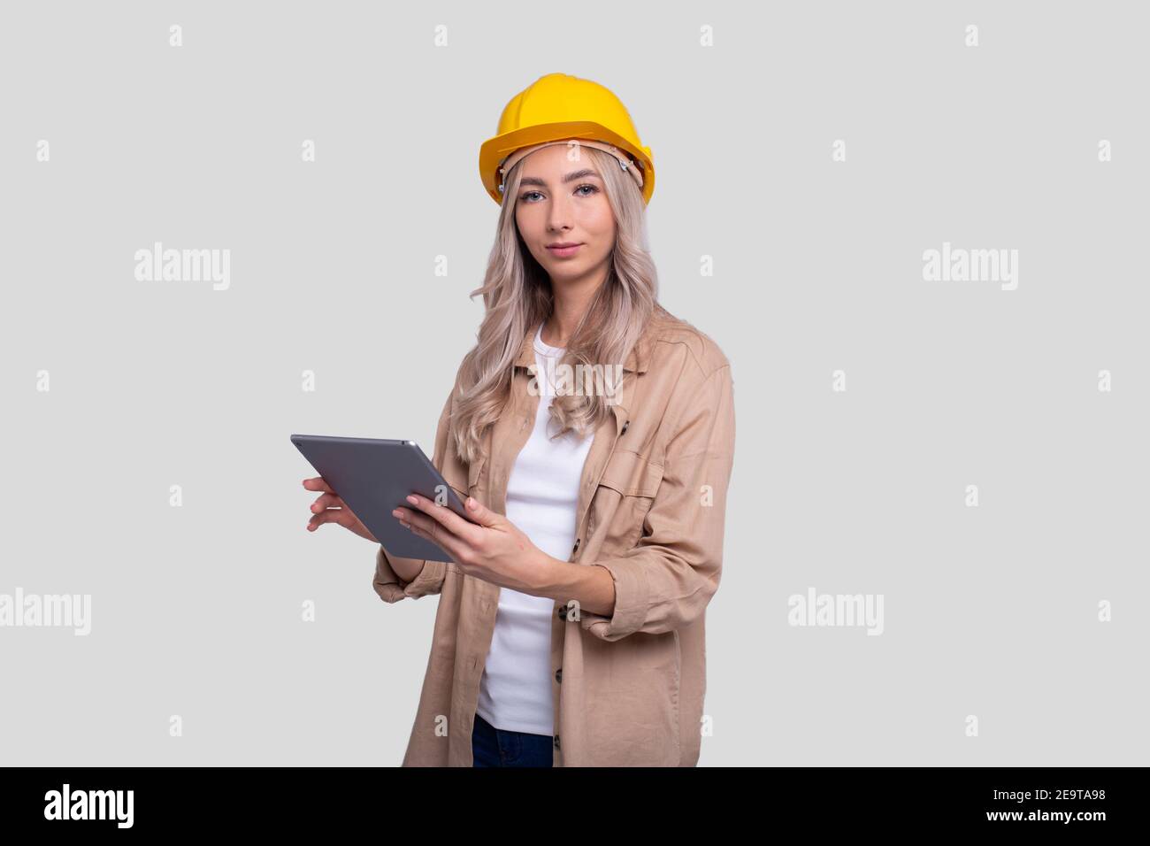 Girl Construction Worker Holding Tablet Watching Front Isolated. Girl ...