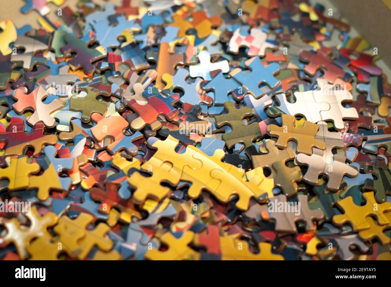 Jigsaw puzzle pieces in a box Stock Photo - Alamy