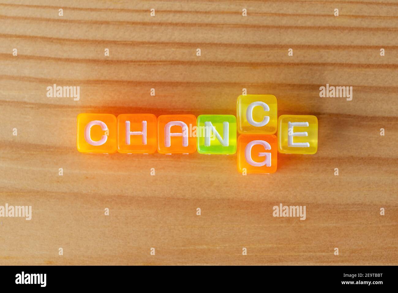 CHANGE CHANCE text with color letters cubes on wooden background ...