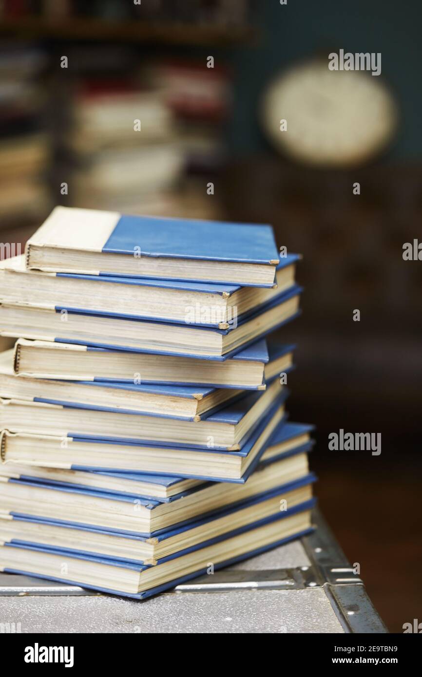 Vertical shot of a stack of books with white and blue covers Stock ...
