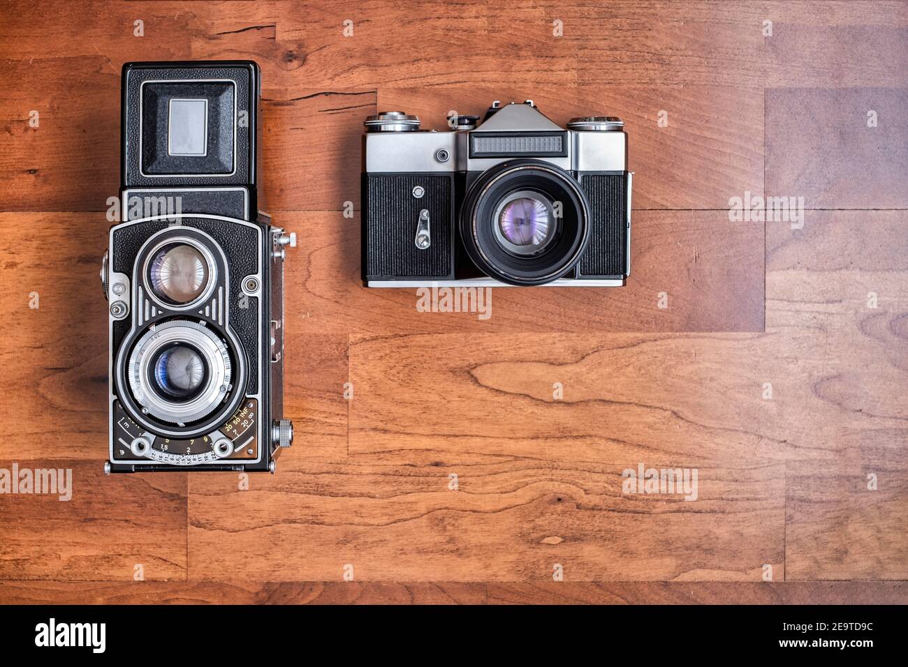 an old medium format twin lens reflex camera and an old 35mm reflex ...