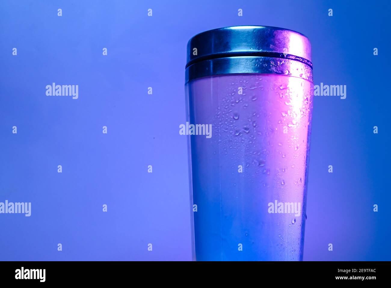 cocktail shaker in pink tones on purple background Stock Photo - Alamy