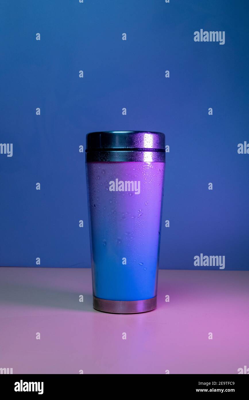 cocktail shaker in pink tones on purple background Stock Photo - Alamy