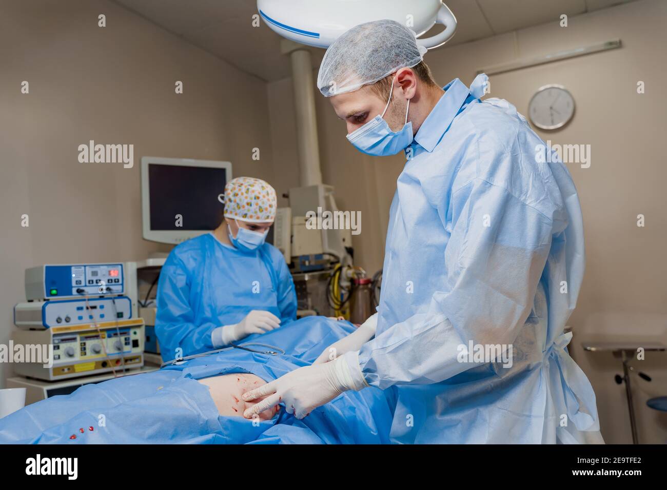 Liposuction for lipofilling surgery operation. 2 surgeon do plastic ...