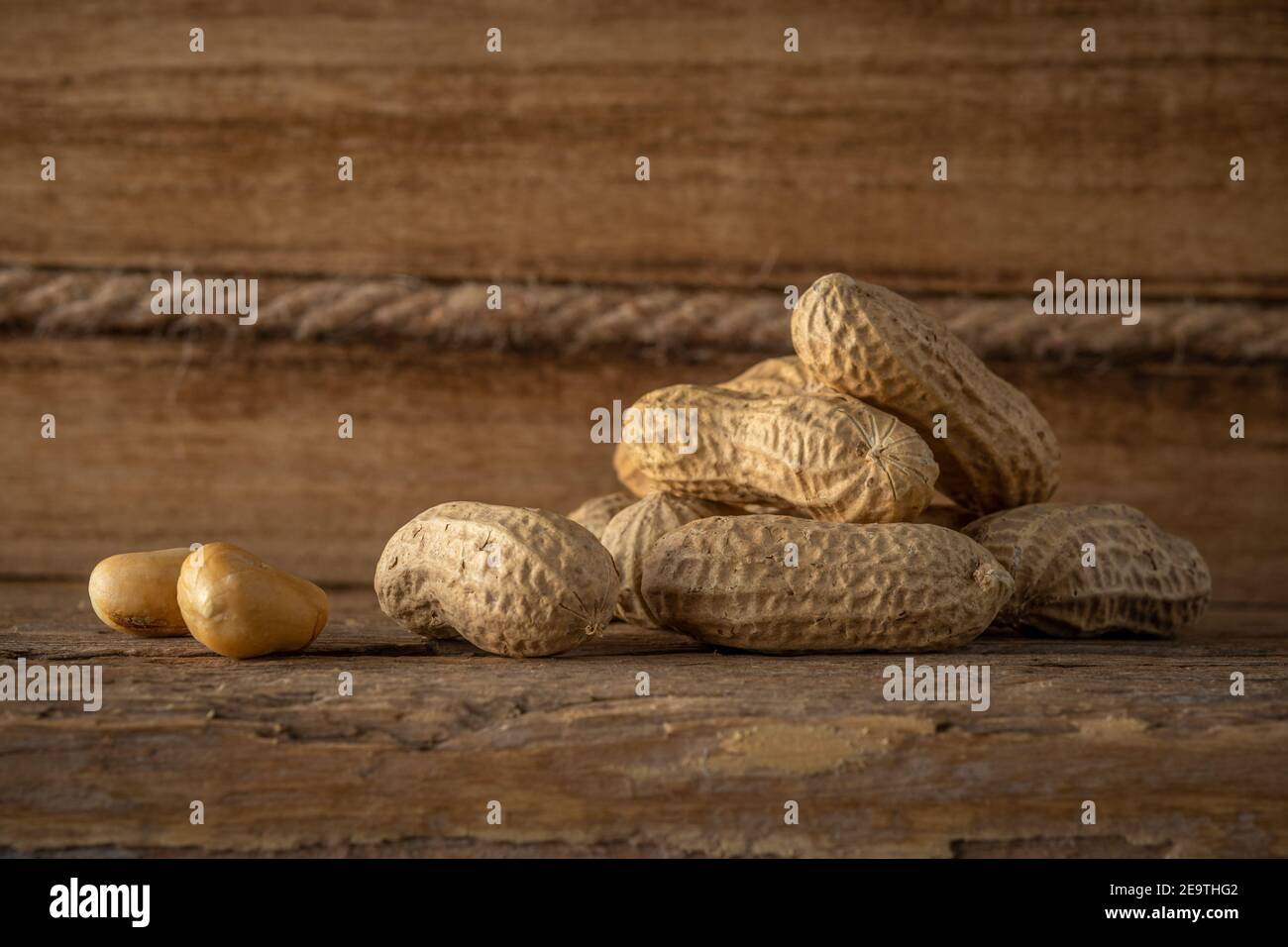 Peanut in a shell on wooden background. Food background. Top view Stock ...