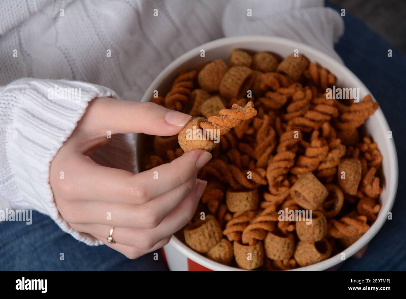 A bowl of Israeli Bissli wheat snacks with different flavors and shapes ...