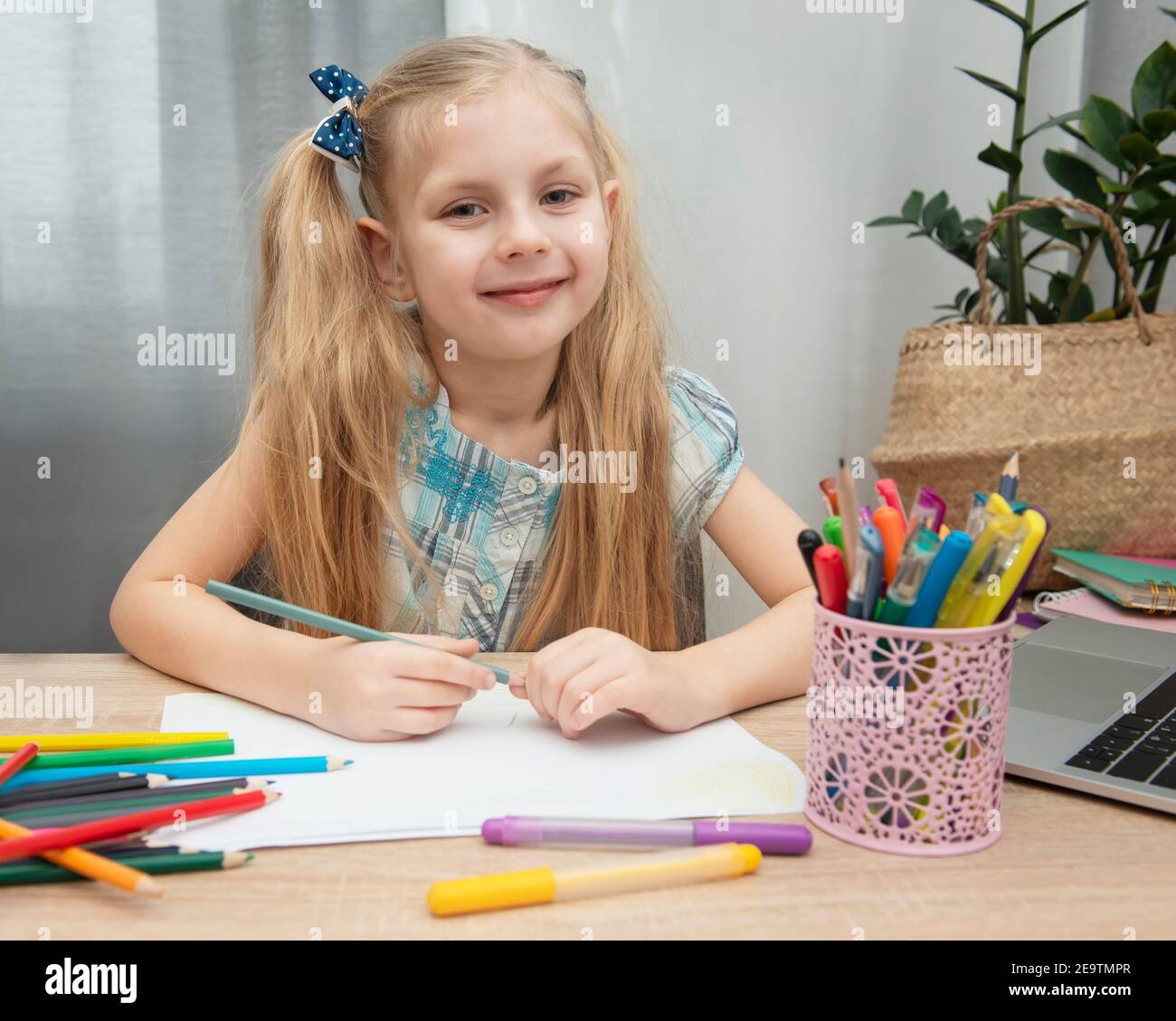 Cute girl doing homework in her room at home Stock Photo - Alamy
