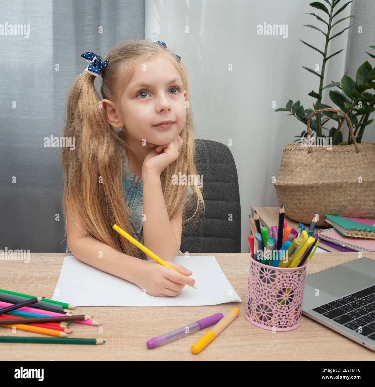 Cute girl doing homework in her room at home Stock Photo - Alamy