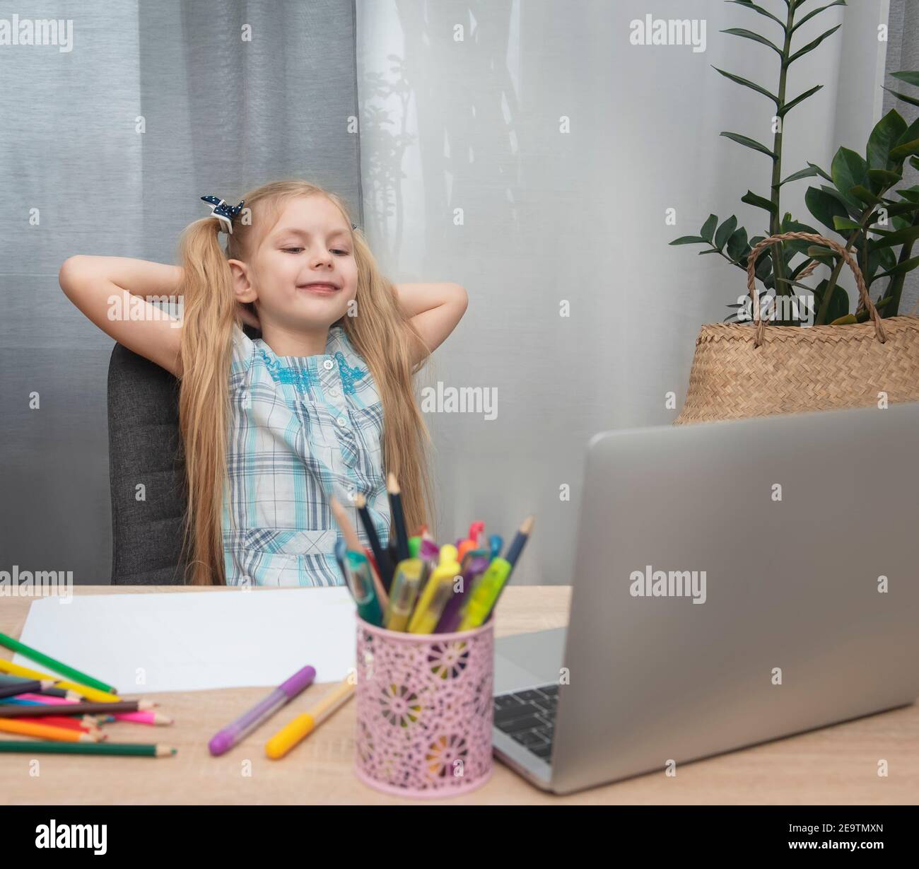 Cute girl doing homework in her room at home Stock Photo - Alamy