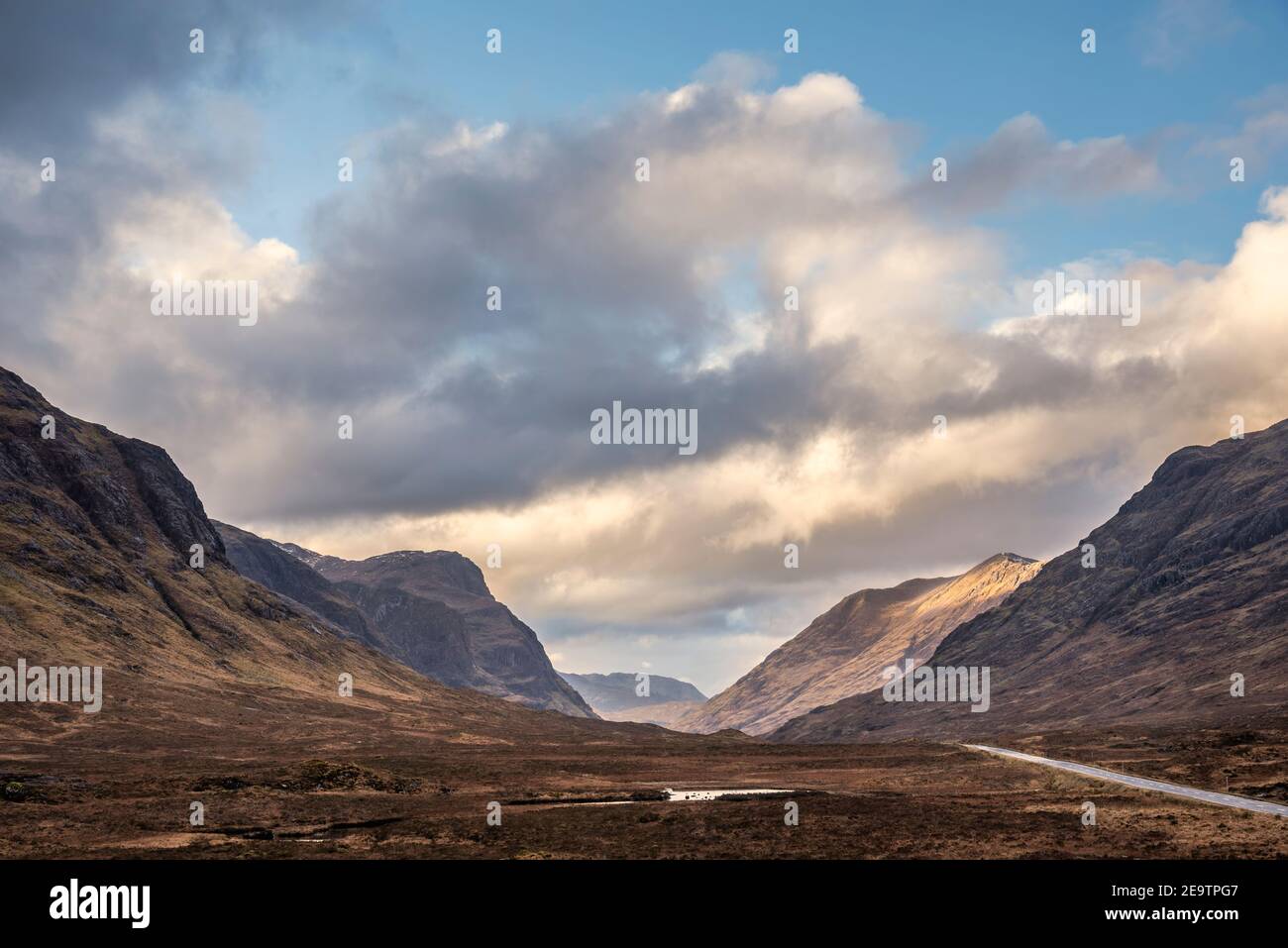 Stunning landscape image view down Glencoe Valley in Scottish Highlands ...