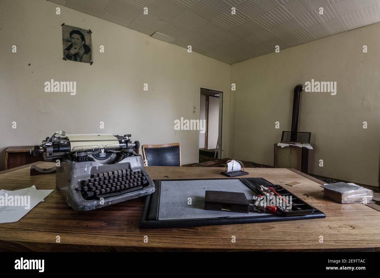 abandoned office table in a factory Stock Photo - Alamy