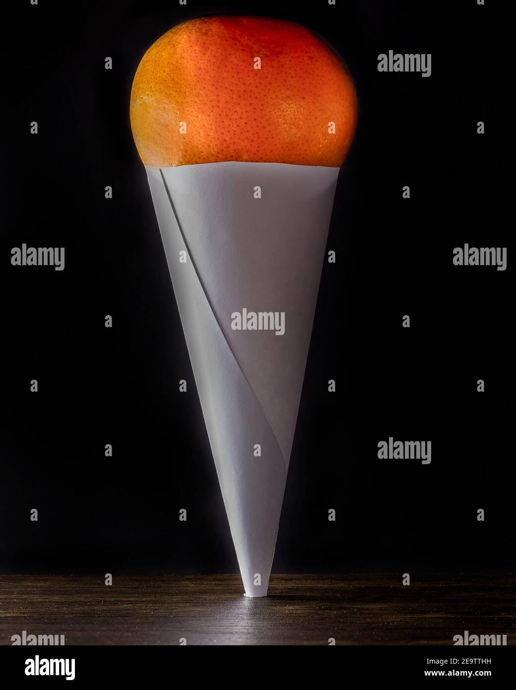 Orange ice cream cone hi-res stock photography and images - Alamy