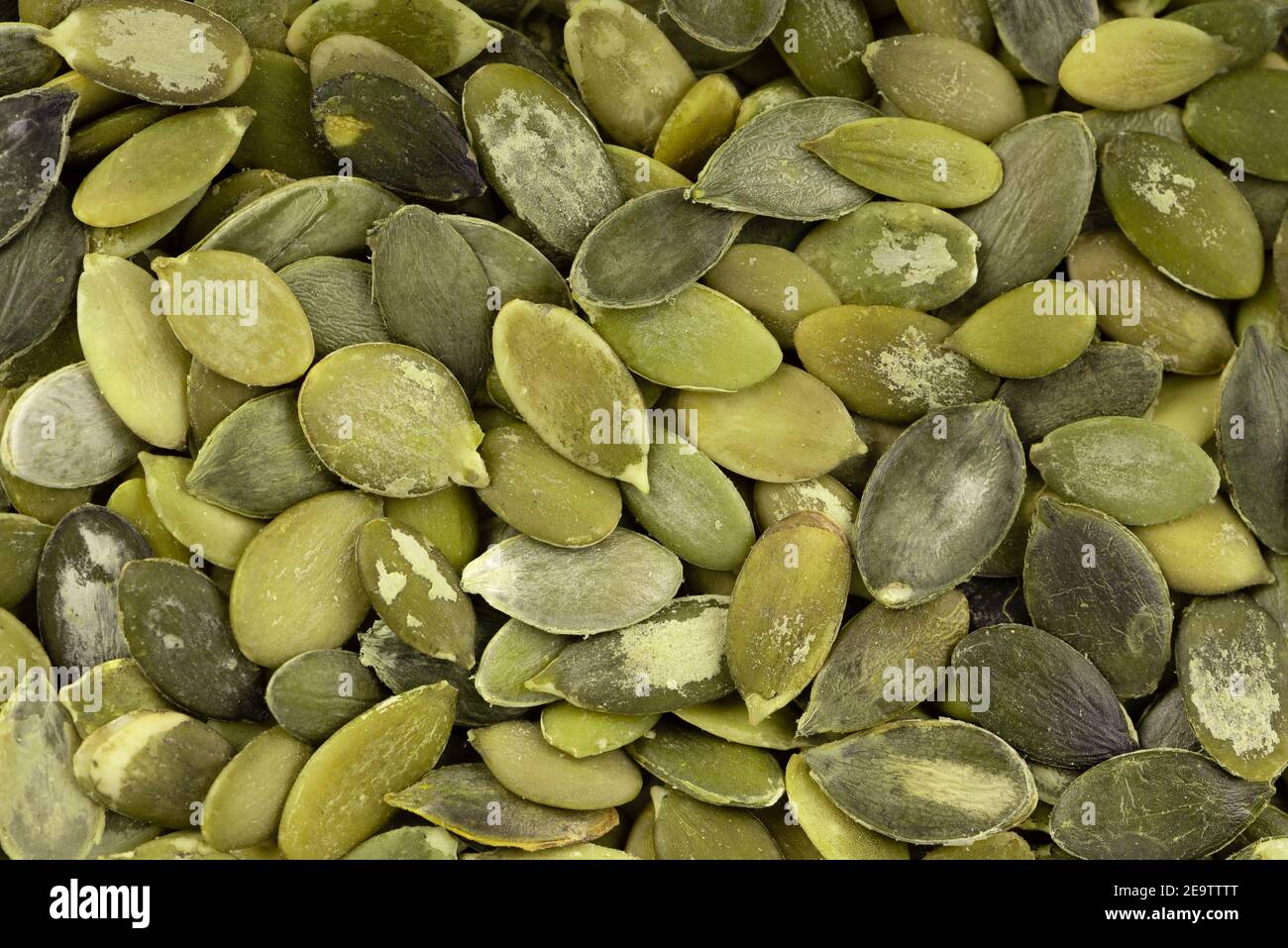 Pumpkin seeds background. Green pepita seeds. Top view Stock Photo - Alamy