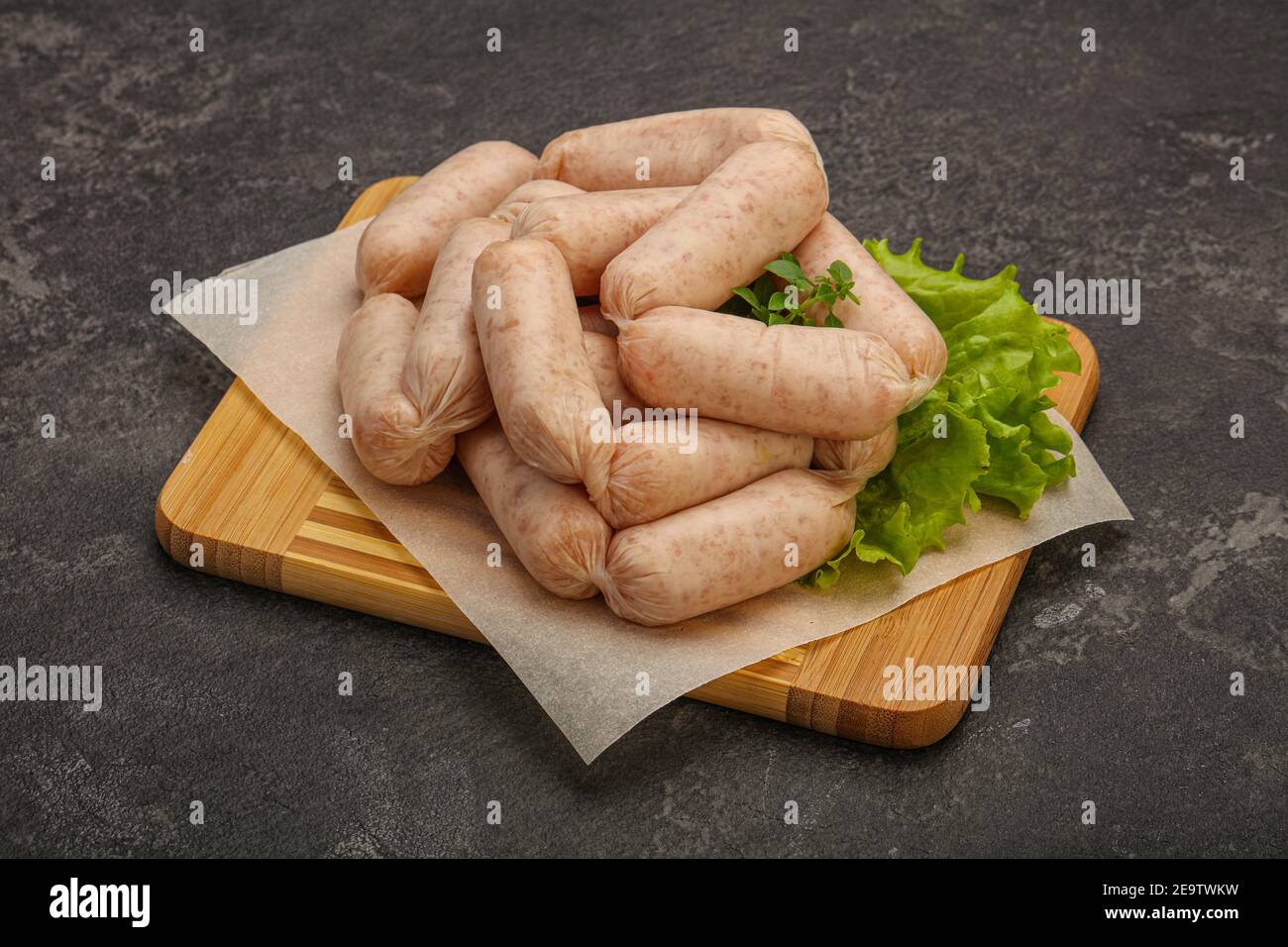 Raw natural chicken baby sausages for roast Stock Photo - Alamy