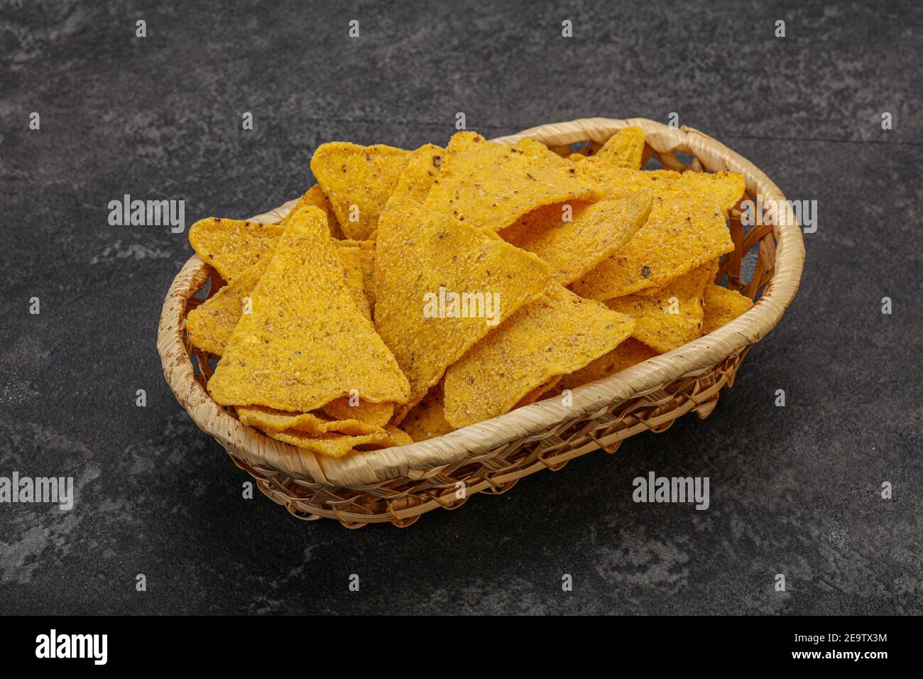 Mexican crunchy corn nachos triangle heap Stock Photo - Alamy