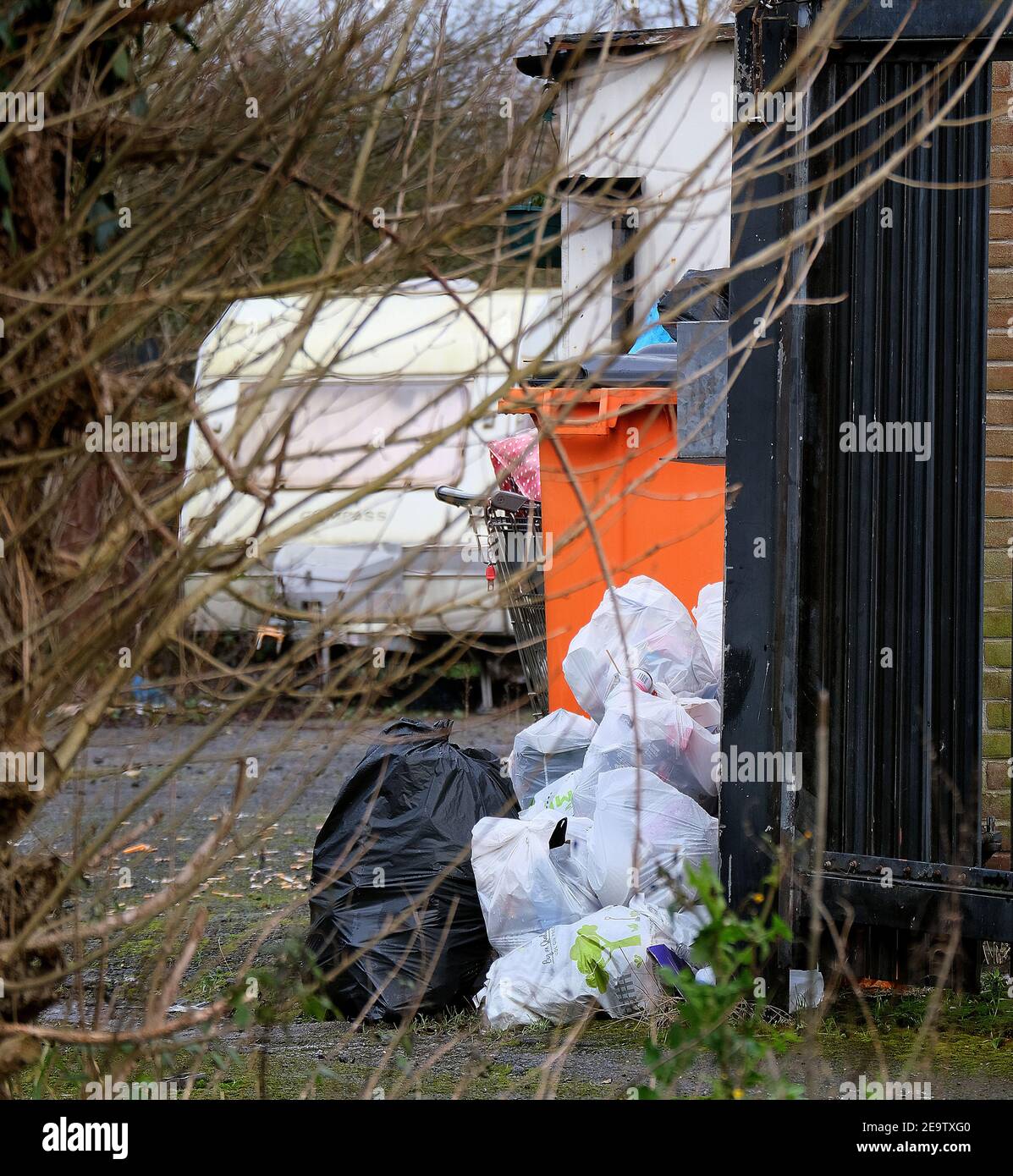 Rubbish dumped outside building used by squatters and requiring clean ...