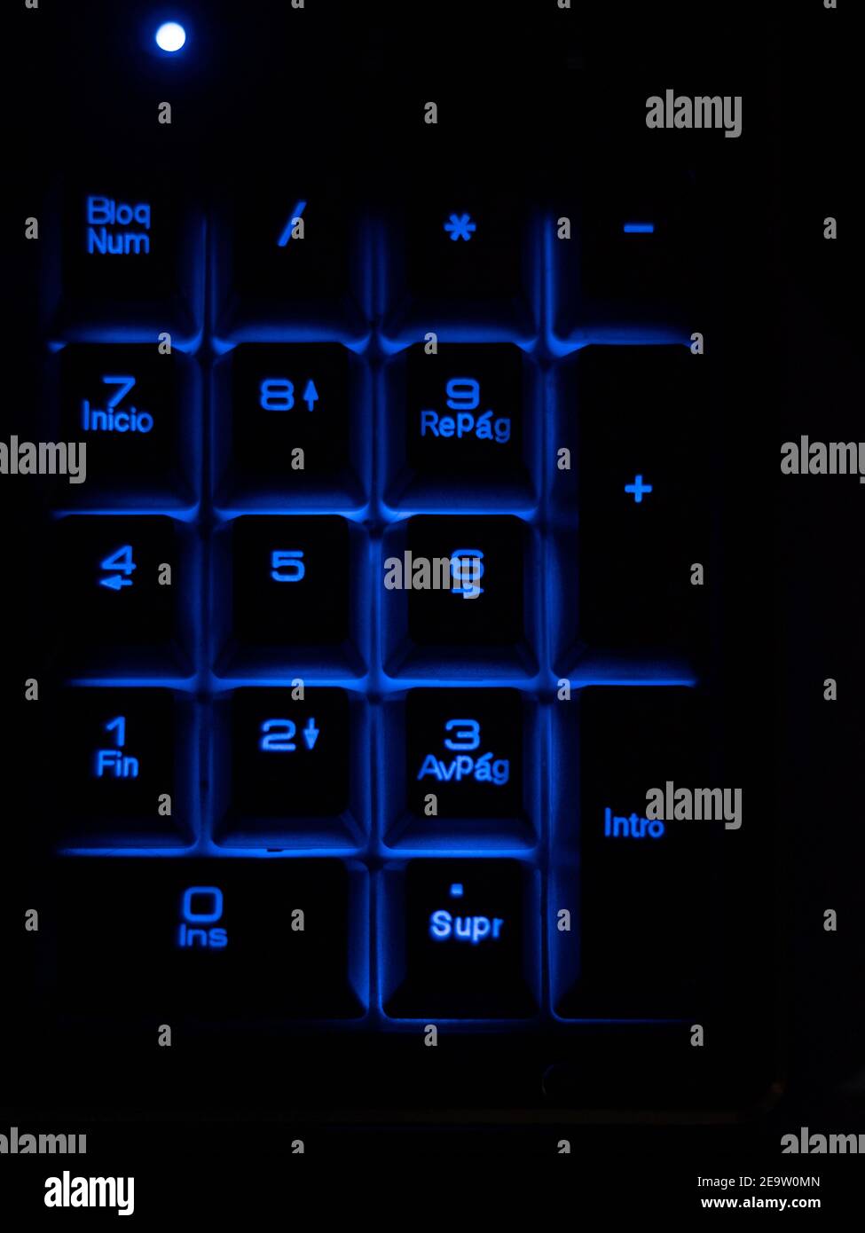 Close up numbers in a black keyboard with blue retro light Stock Photo ...