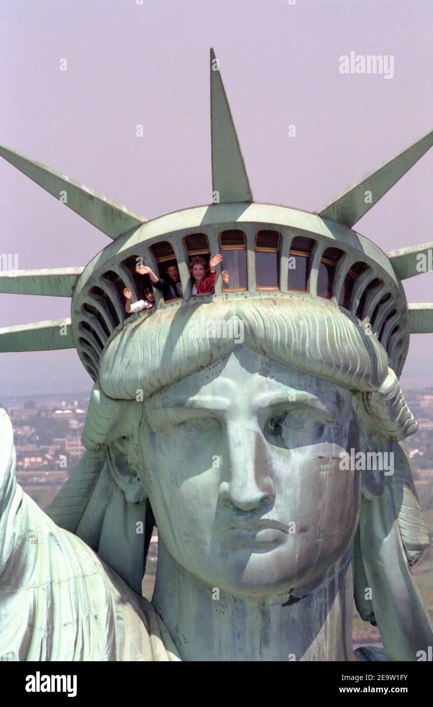 Nancy Reagan waves while visiting the Statue of Liberty in New York ...