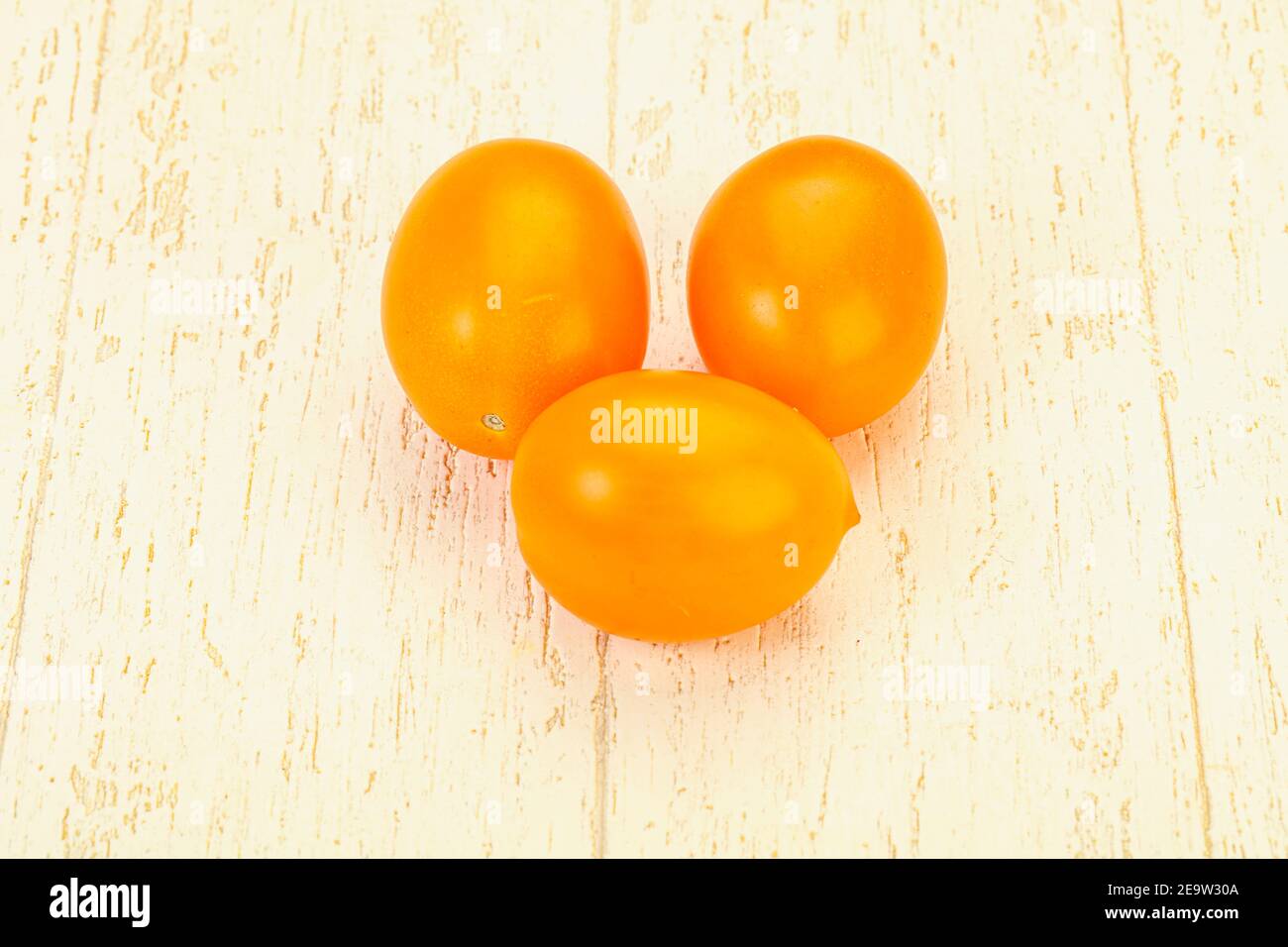 Tasty vegetables - Yellow tomato heap over background Stock Photo - Alamy