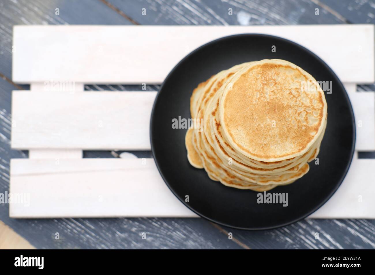 stack of classic american pancakes on a wooden rack. traditional family ...