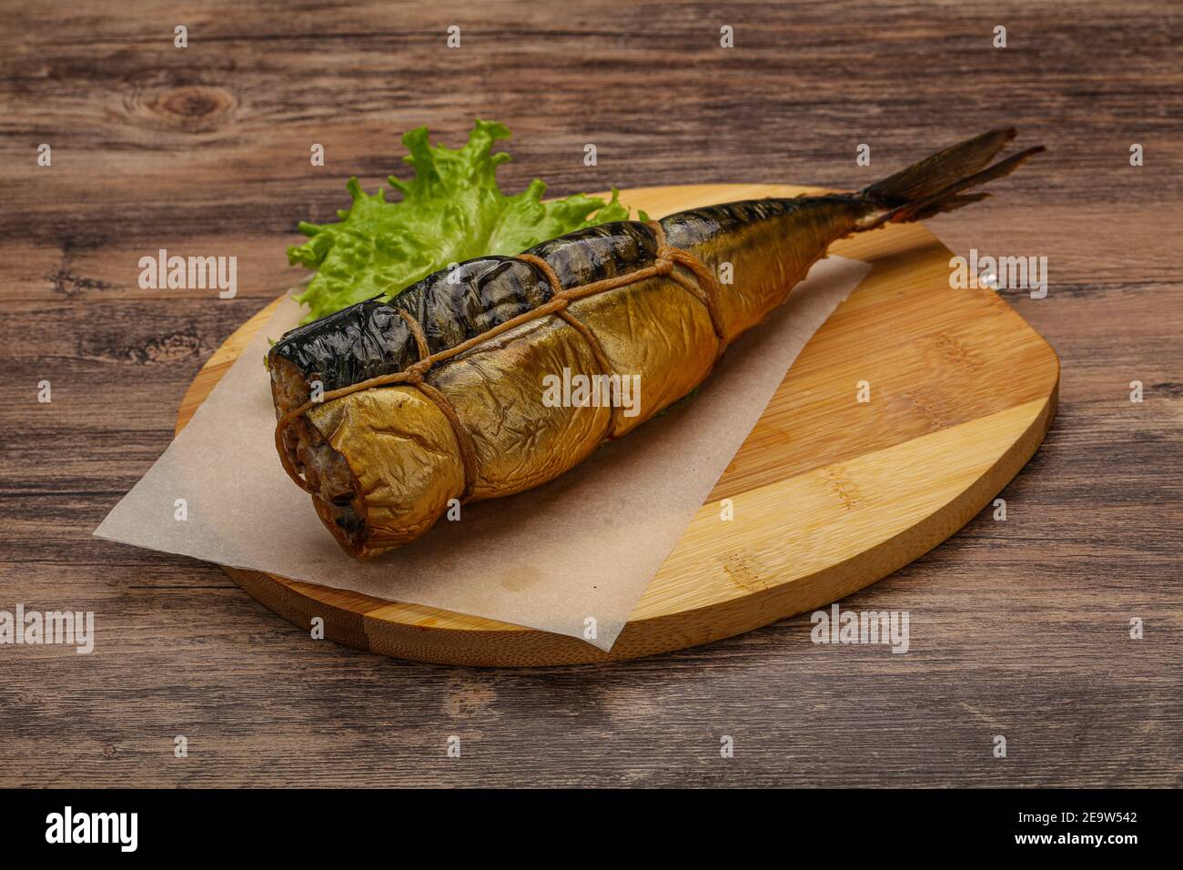 Smoked tasty mackerel fish snack over board Stock Photo - Alamy