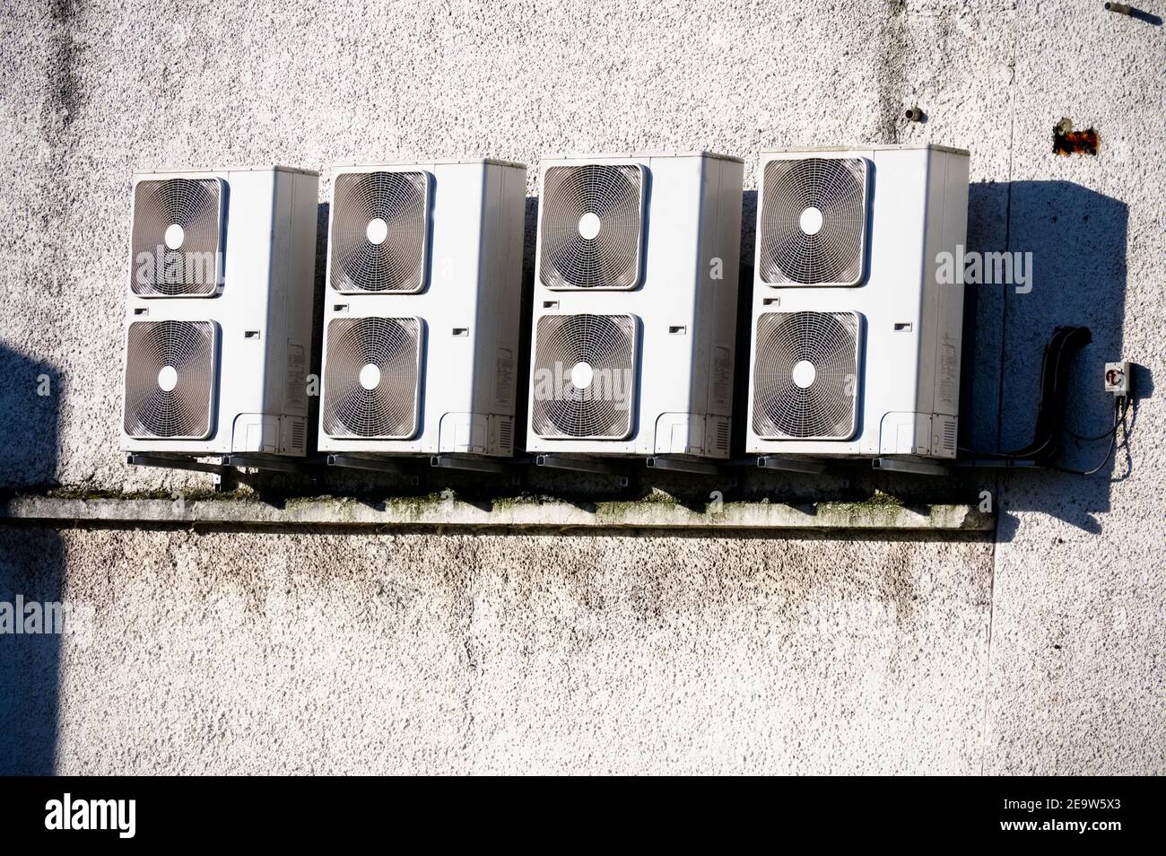 Condenser units for air conditioning system wall mounted outdoors Stock ...