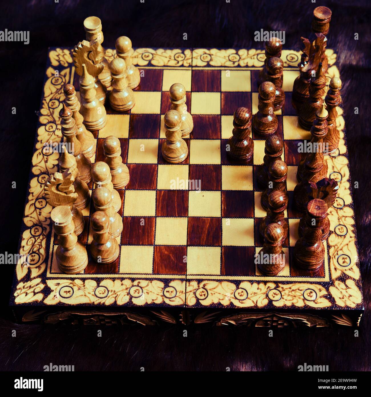 Retro wooden chess set on a furry hide, top view of the chessboard ...