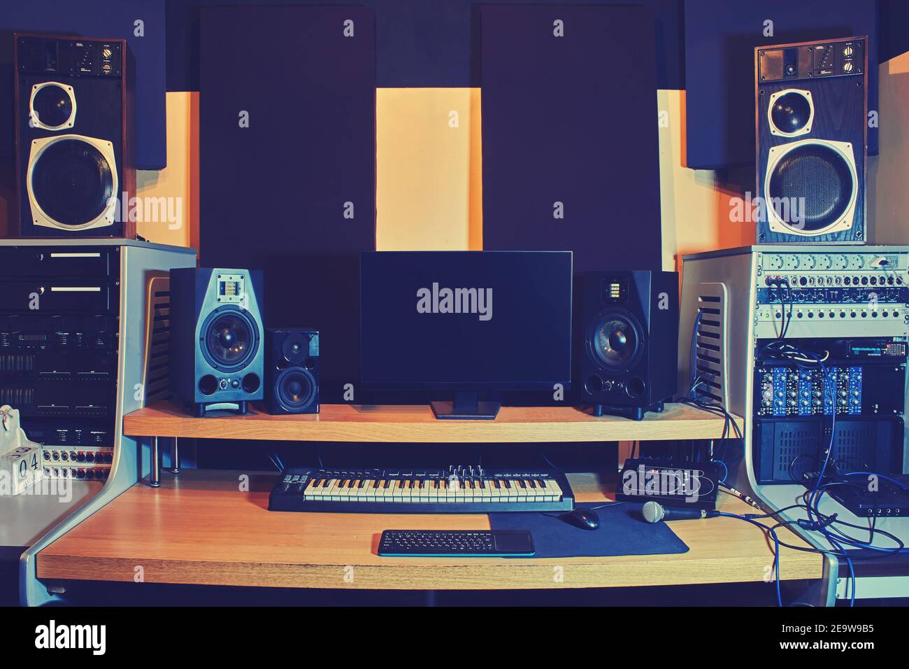 Computer, speakers and audio equipment on the table in the recording ...