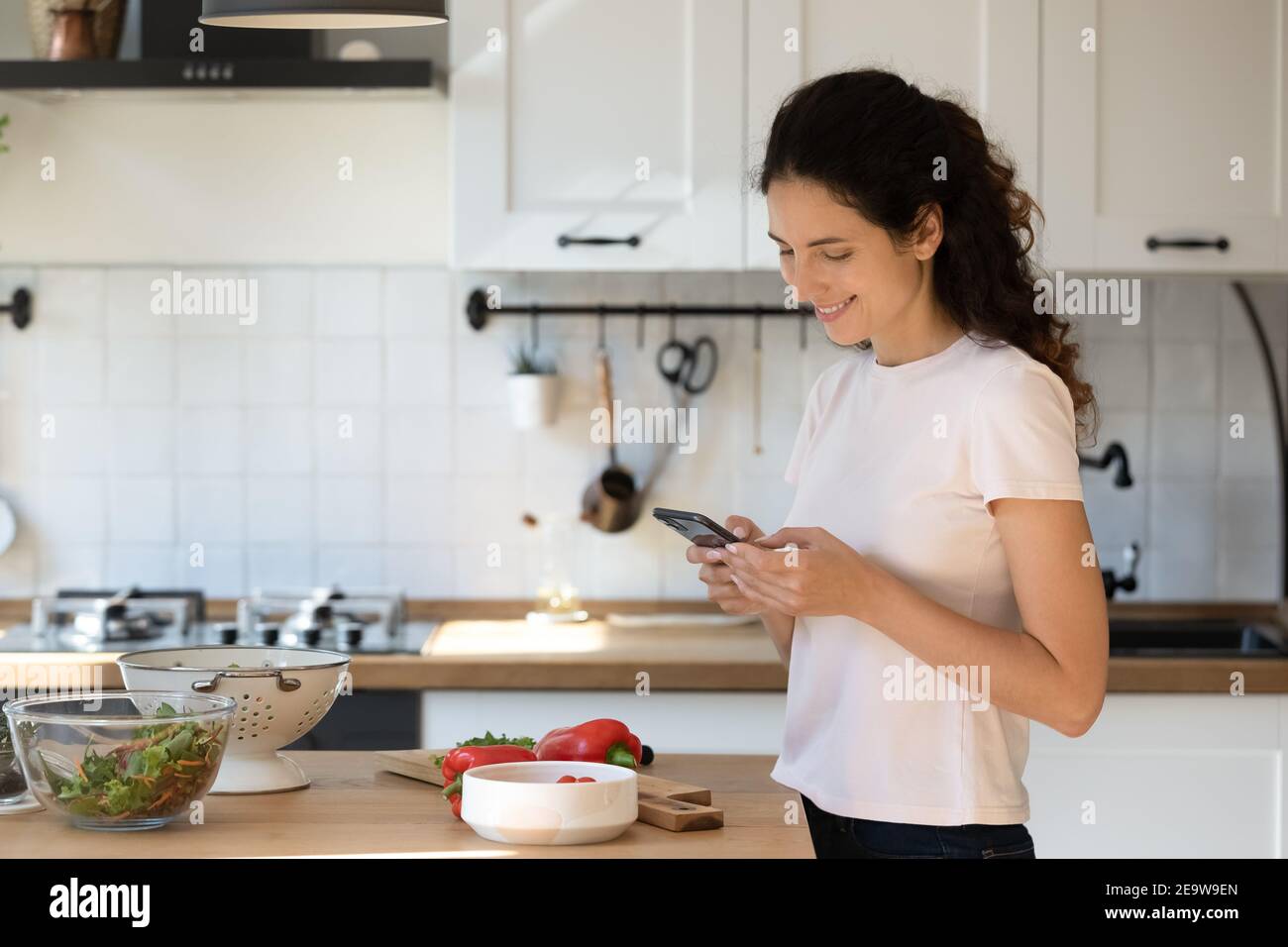 Smiling wife calling husband asking what to make for lunch Stock Photo ...