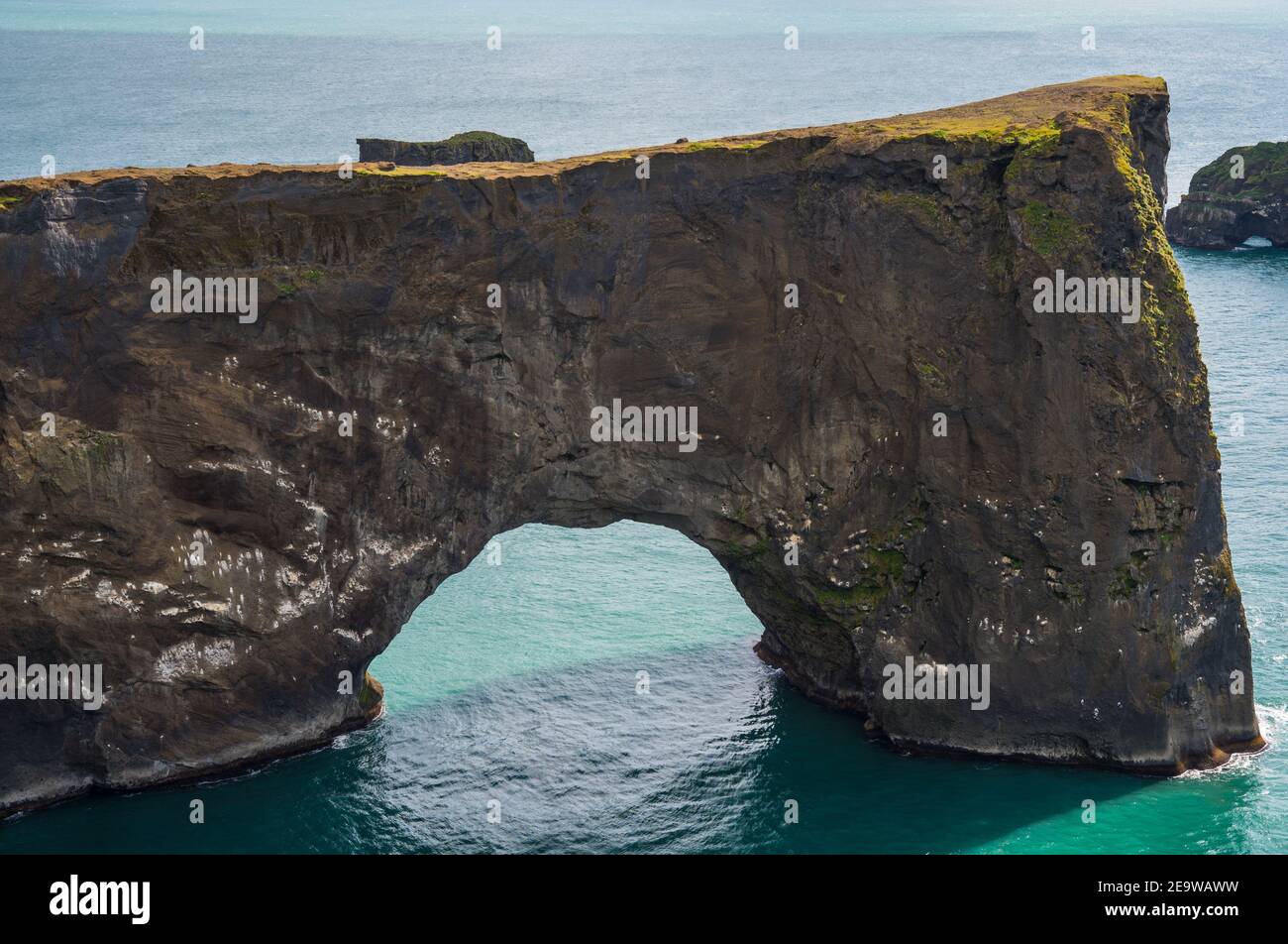 The hole through the cliff in Dyrholaey peninsula in south Iceland ...
