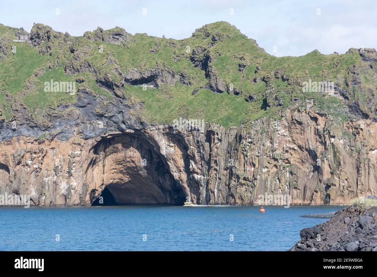 Hole in the cliff on island of Heimaey in Vestmannaeyjar of the south ...