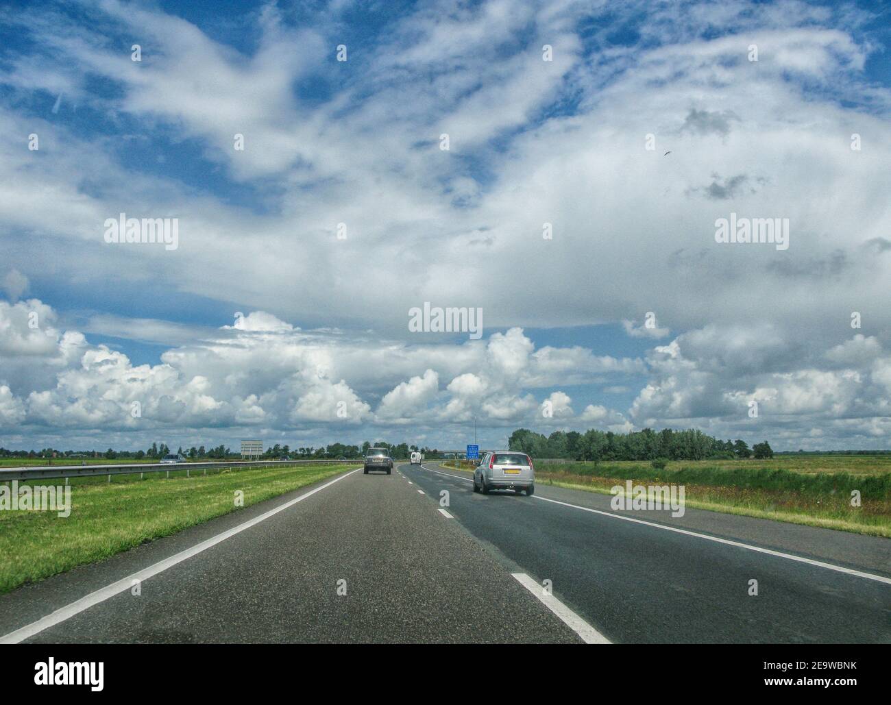 Famous Dutch light with cloudscape above highway Stock Photo - Alamy