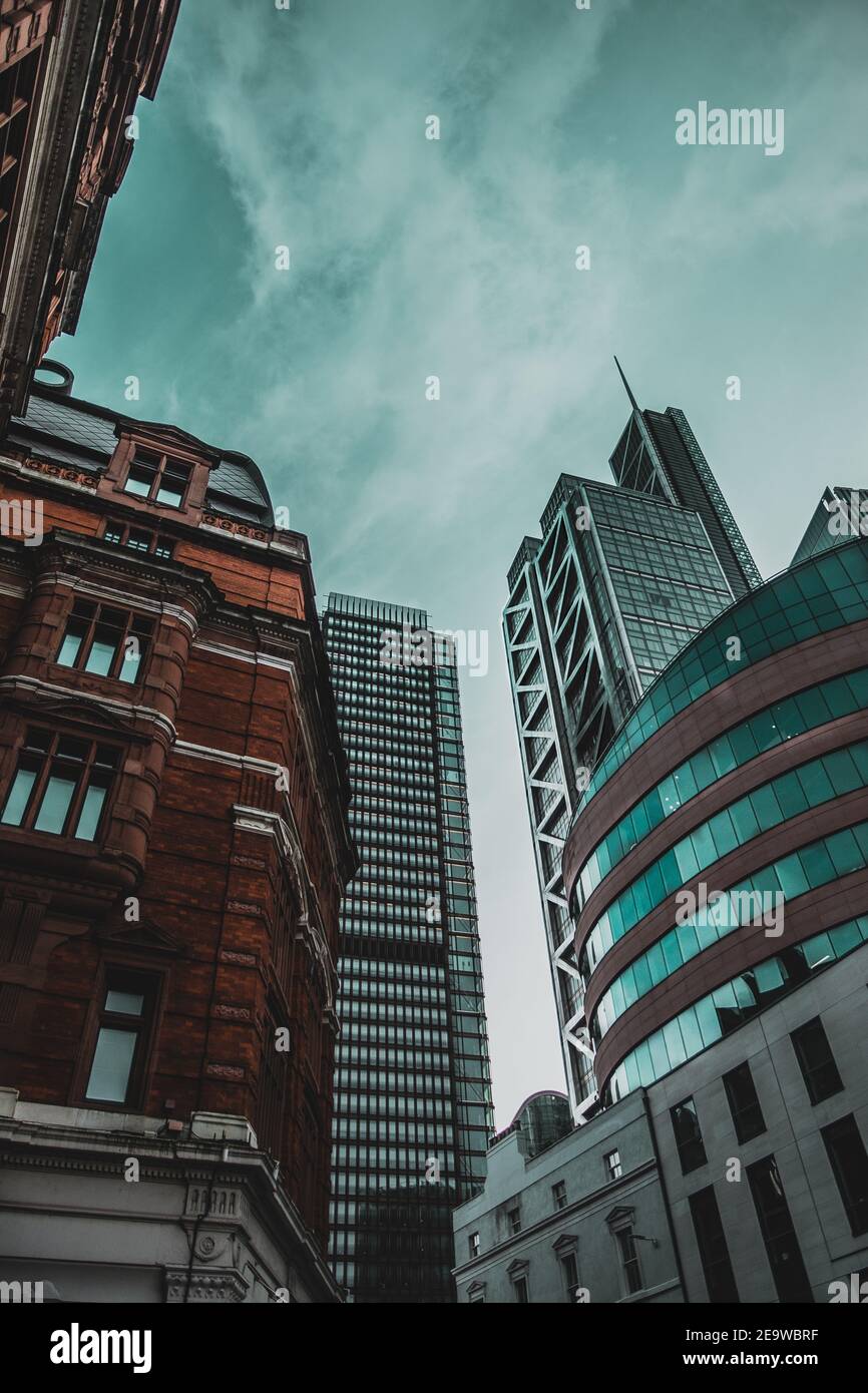 Street view looking up into the massive skyscrapers of london city ...
