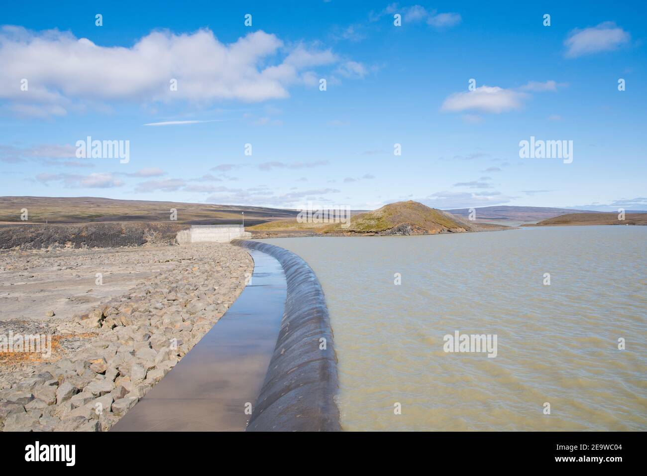 The Spillway of Spordoldulon reservoir in Iceland on a sunny summer day ...