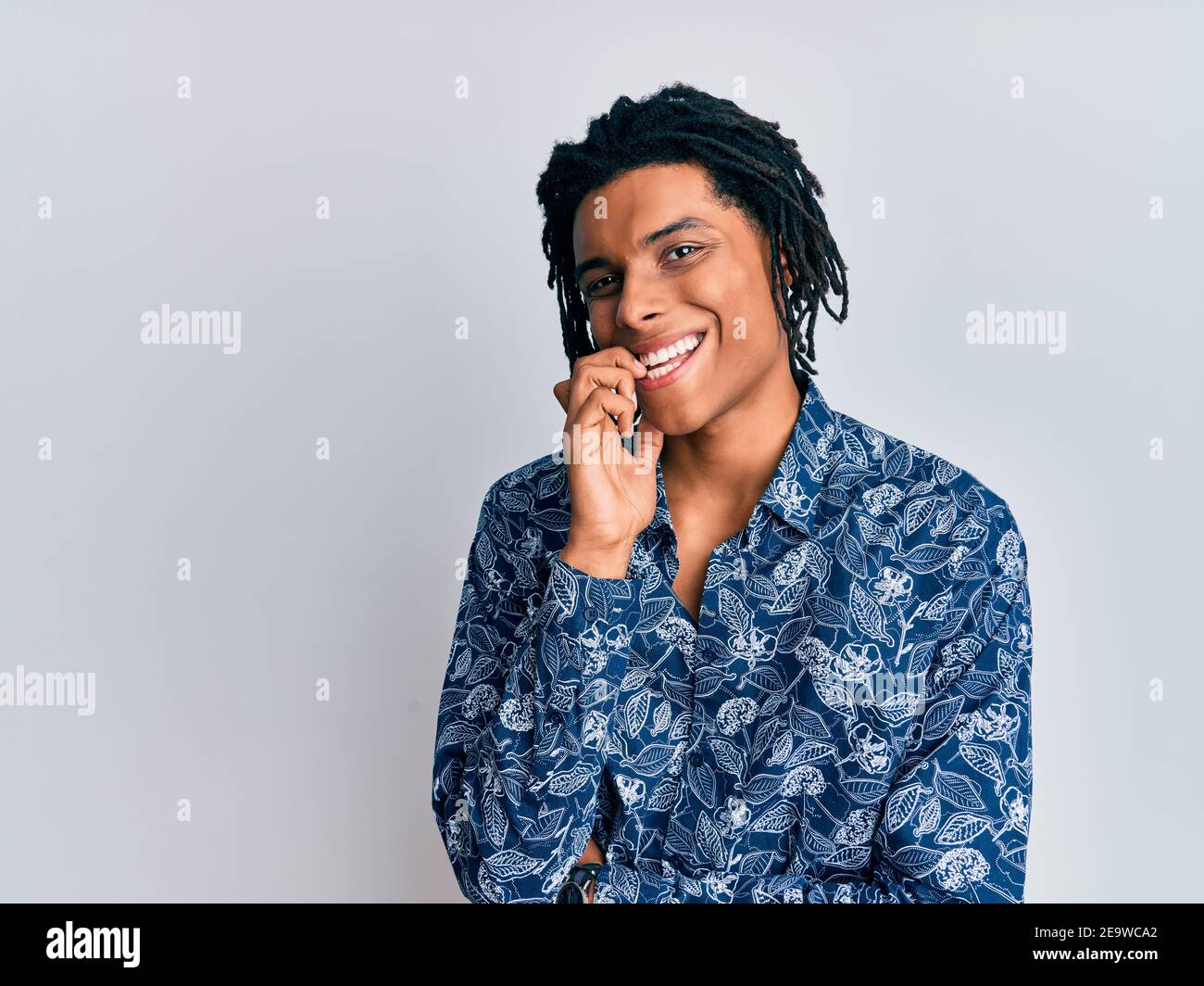 Young african american man wearing 80s style shirt looking confident at ...