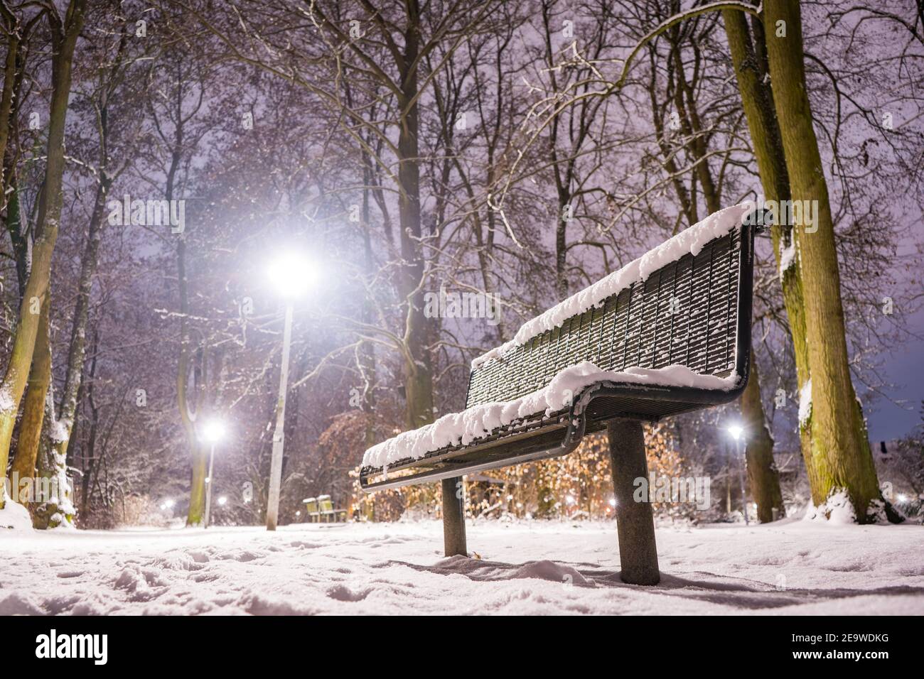snow covered bench in winter at night Stock Photo - Alamy