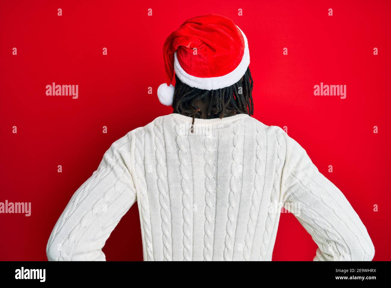 African american man with braids wearing christmas hat standing ...