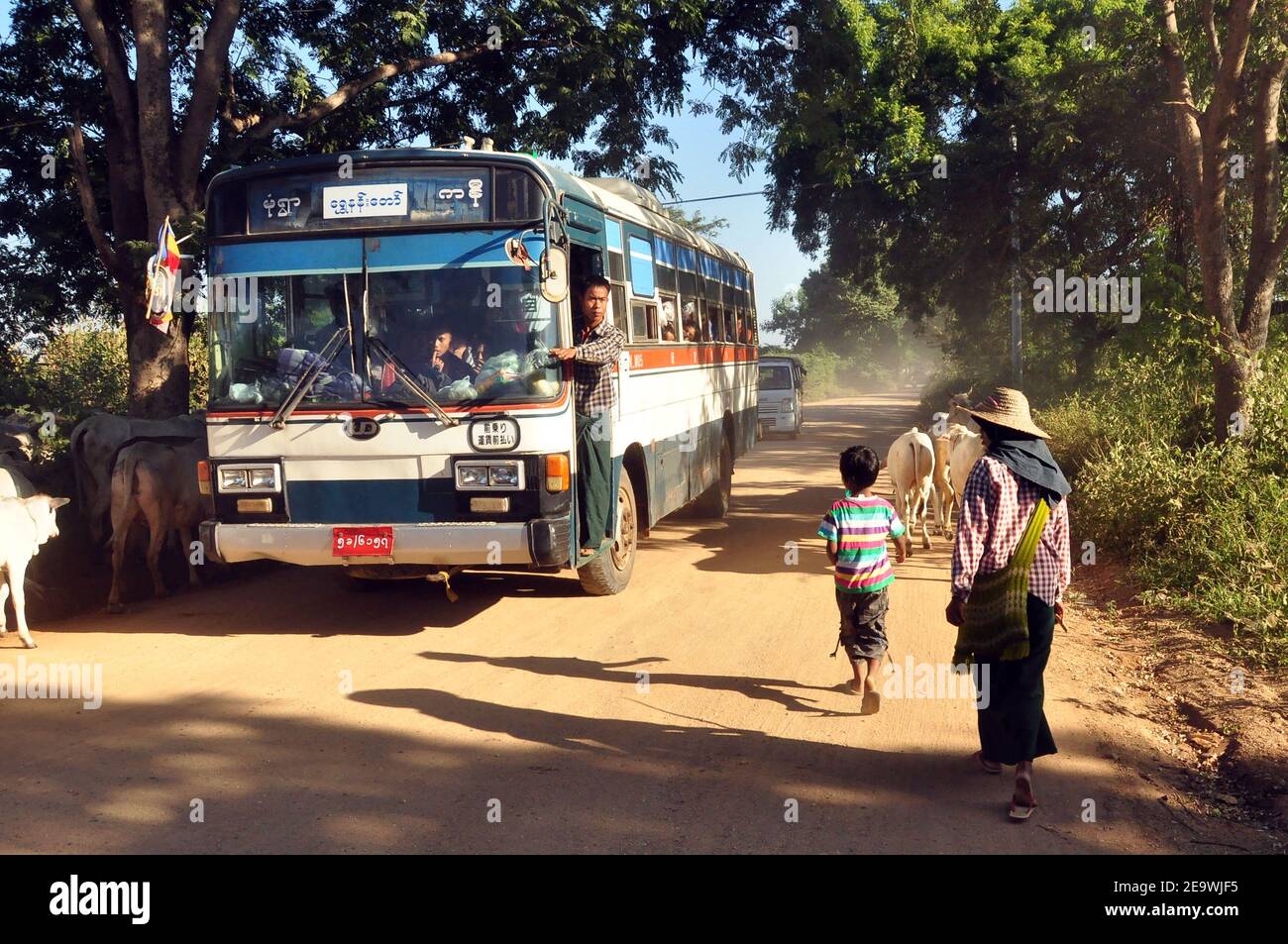BAGAN, MYANMAR - NOVEMBER 18, 2015: Bus on rural road in village, View ...