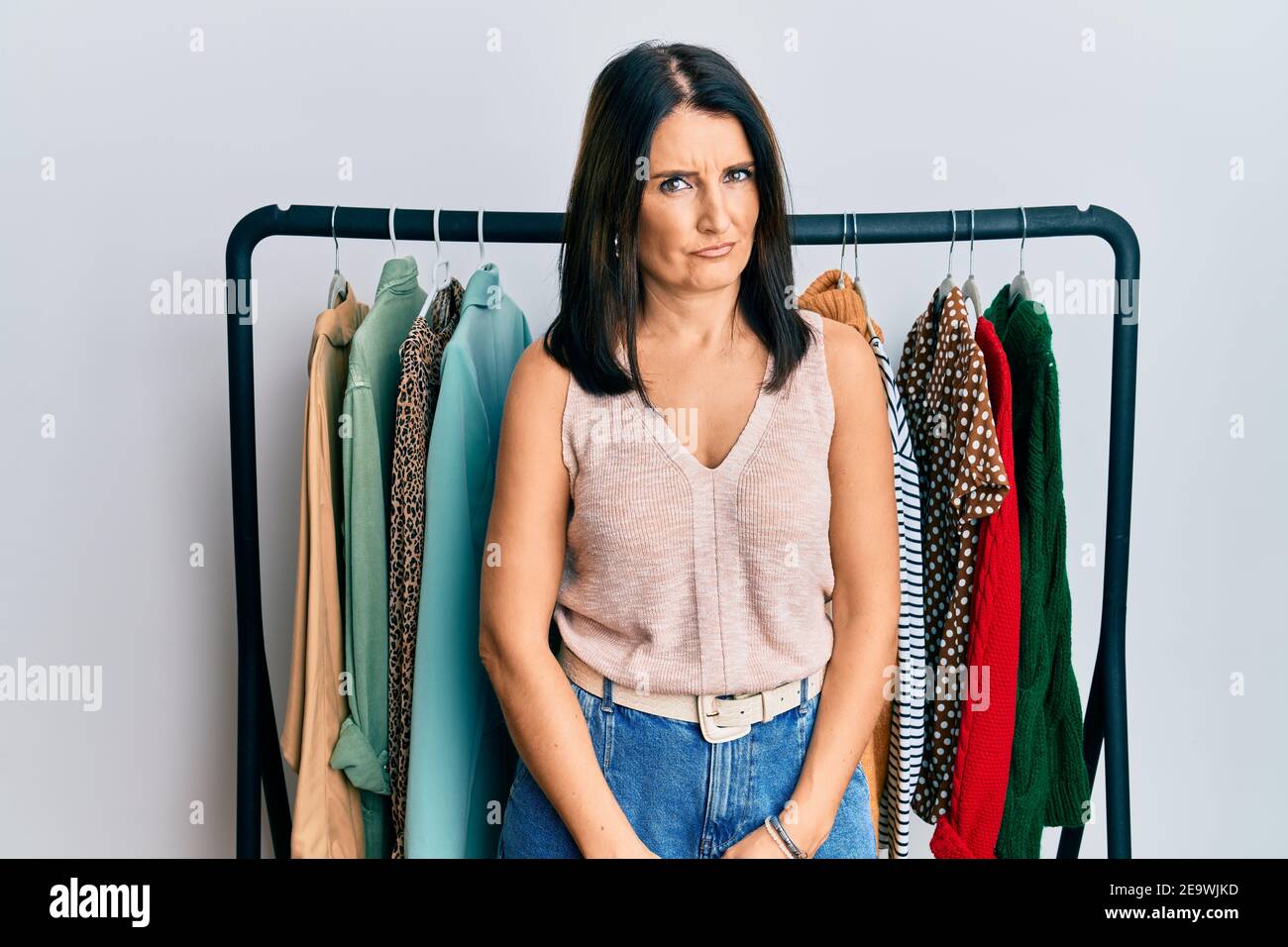 Middle age brunette woman working as professional personal shopper ...