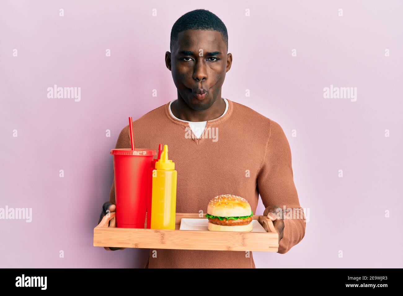 Bearded Man Eating Fish